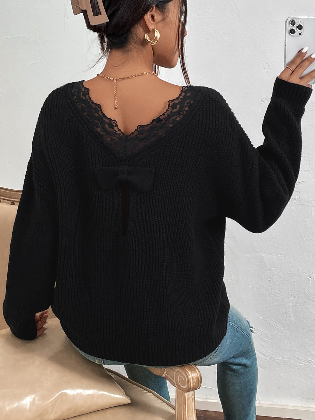 Pull en dentelle découpé à nœud au dos