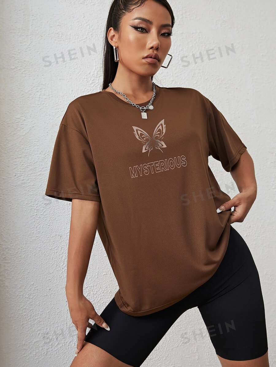 SHEIN EZwear Grafisch drop-shoulder T-shirt met vlinder en slogan MYSTERIEUS, MYSTERIEUS GEVOEL ...