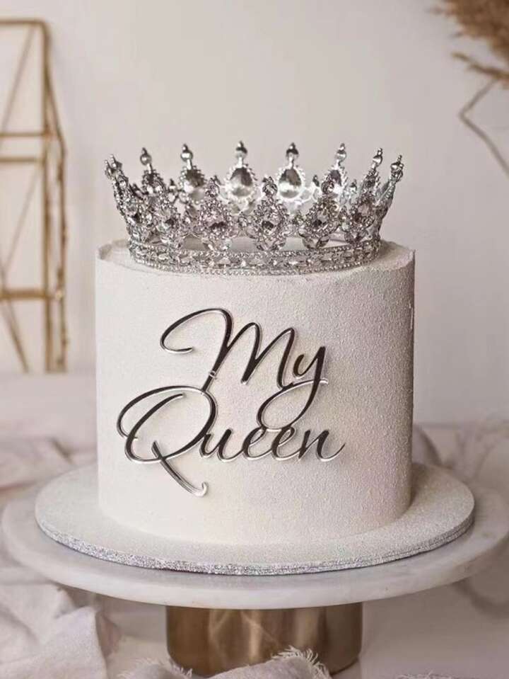 Create a regal cake with queen cake decorations fit for royalty
