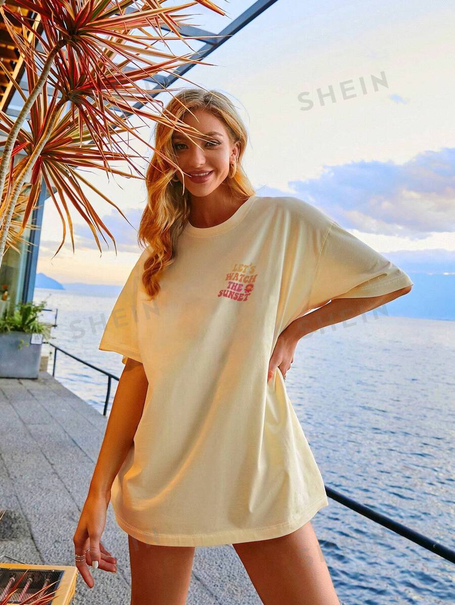 SHEIN EZwear Camiseta de hombros caídos con gráfico de sol y eslogan VAMOS A VER LA PUESTA DE ...