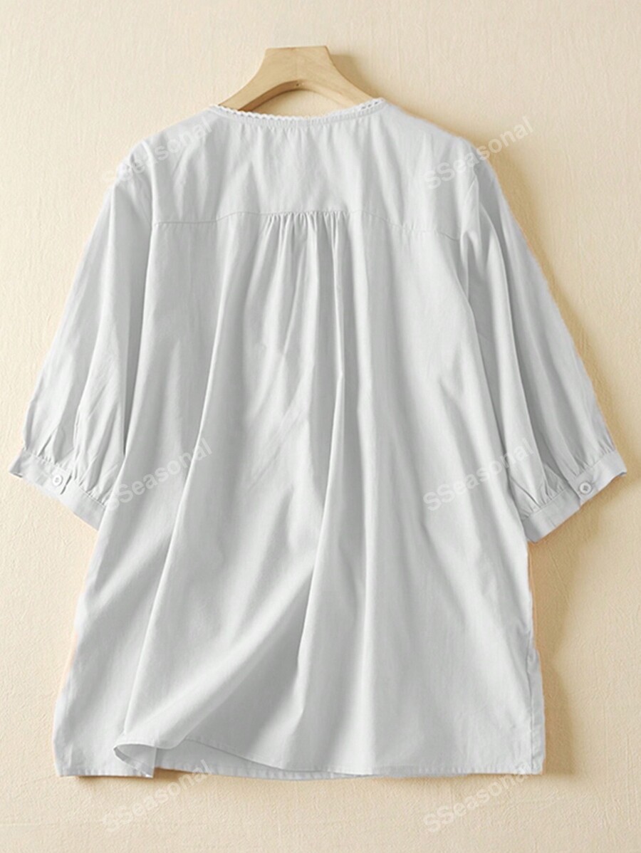 Camisa floja de manga de linterna redonda de bordado floral de unicolor ...