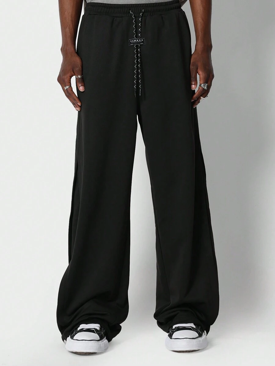 SUMWON Jogger de ajuste sobredimensionado con cordón y detalle de ...