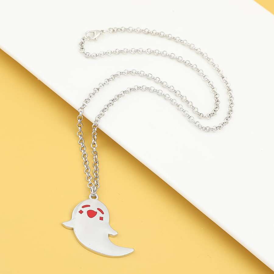 A silver cute ghost necklace worn by women on their daily outings ...