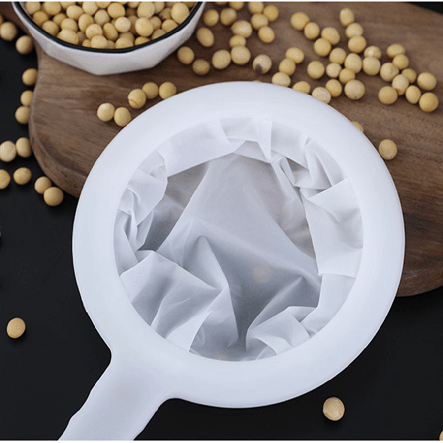 A white ladle, modern plastic round soya-bean milk filter screen batter ...