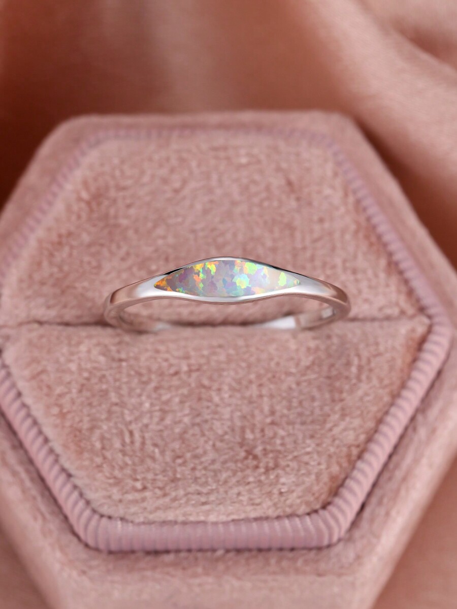 An Elegant And Noble Silver Olive-Tip Shaped White Australian Ring, A ...