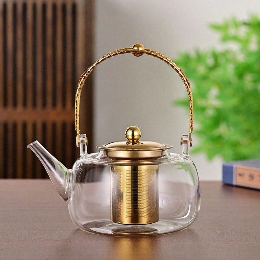 A Teapot With Steel Strainer And Handle, Made Of High Borosilicate ...