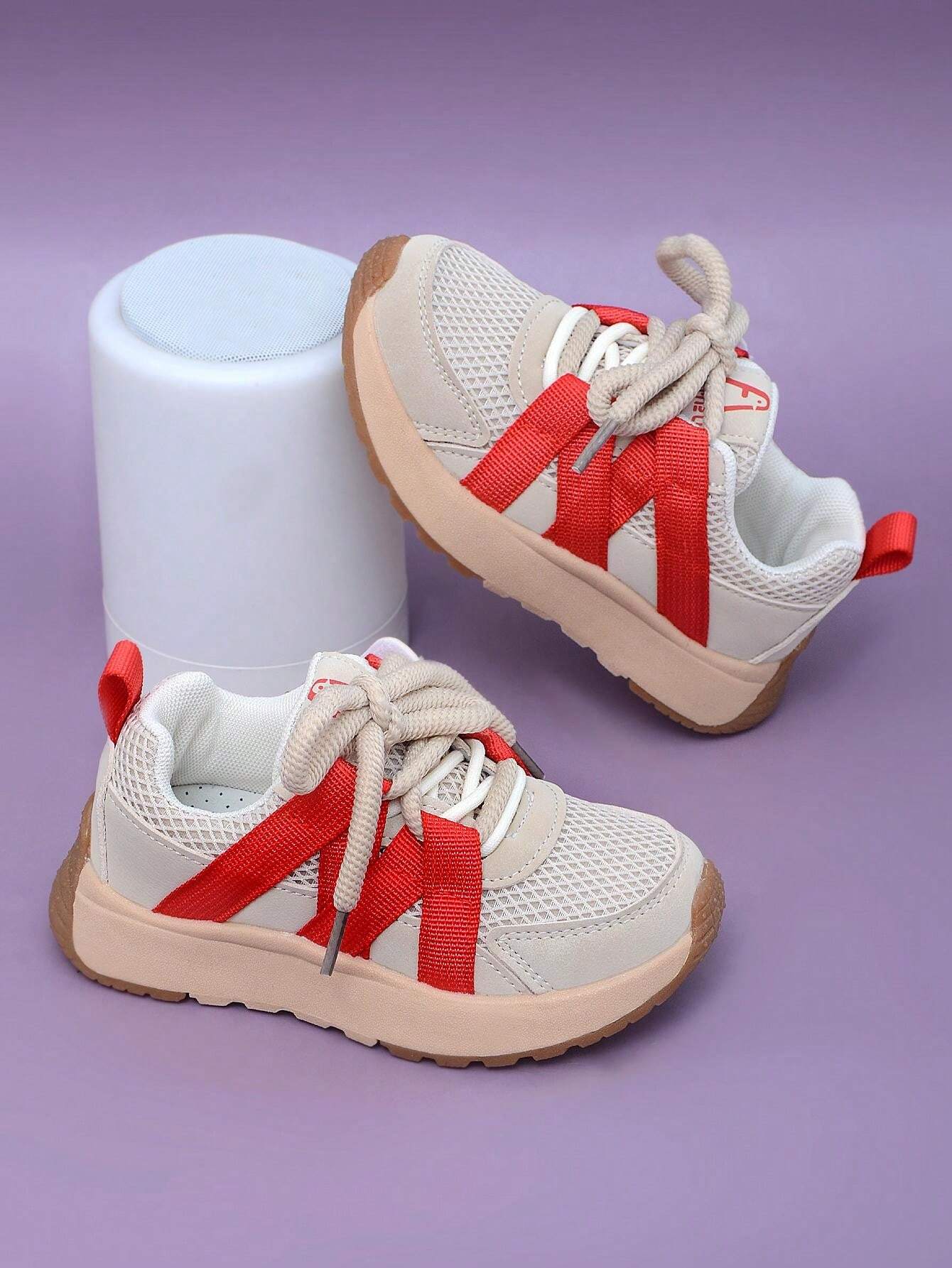 A Pair Of Cute Unisex Children Shoes With Simple Mismatched Laces And ...
