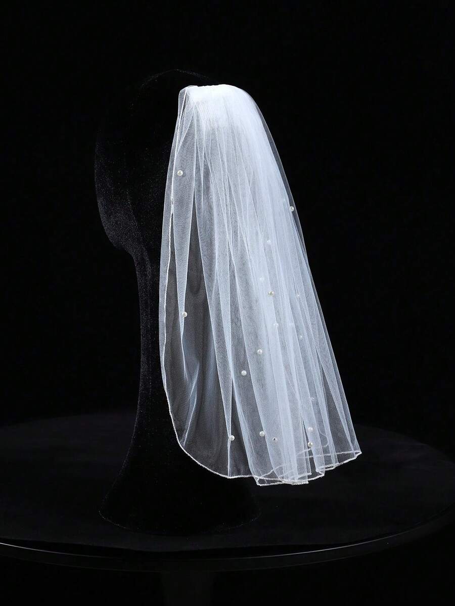 A White Elegant Bridal Veil With A Shoulder Length Veil Adorned With ...