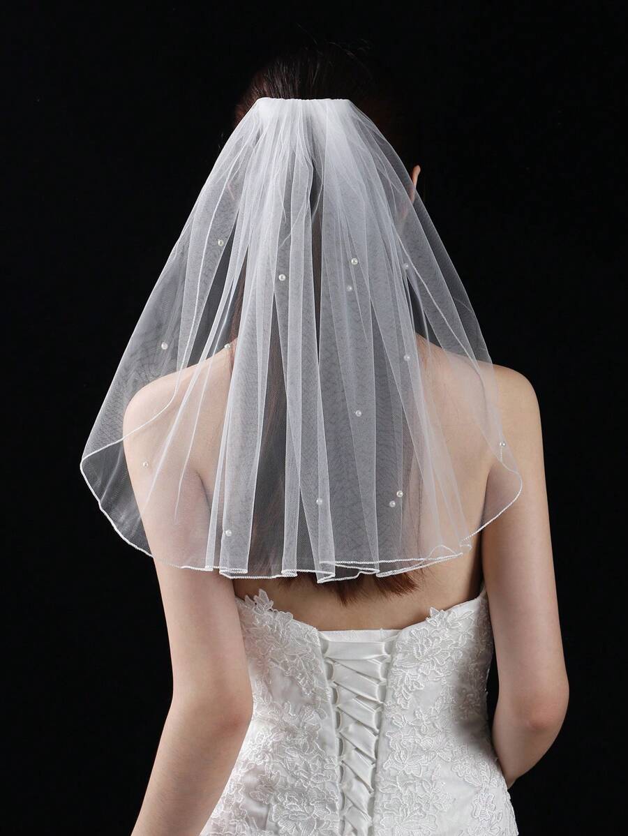 A White Elegant Bridal Veil With A Shoulder Length Veil Adorned With ...