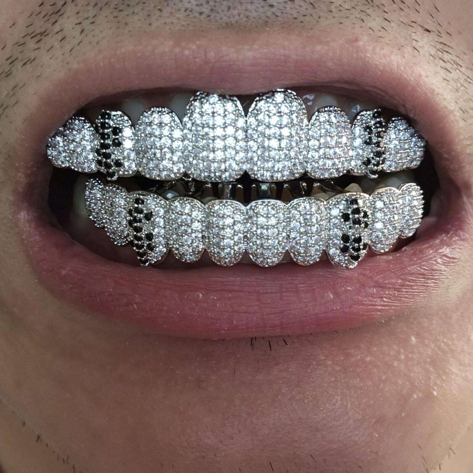A Set Of Fashionable Top And Bottom Teeth With Sparkling Cubic Zirconia ...