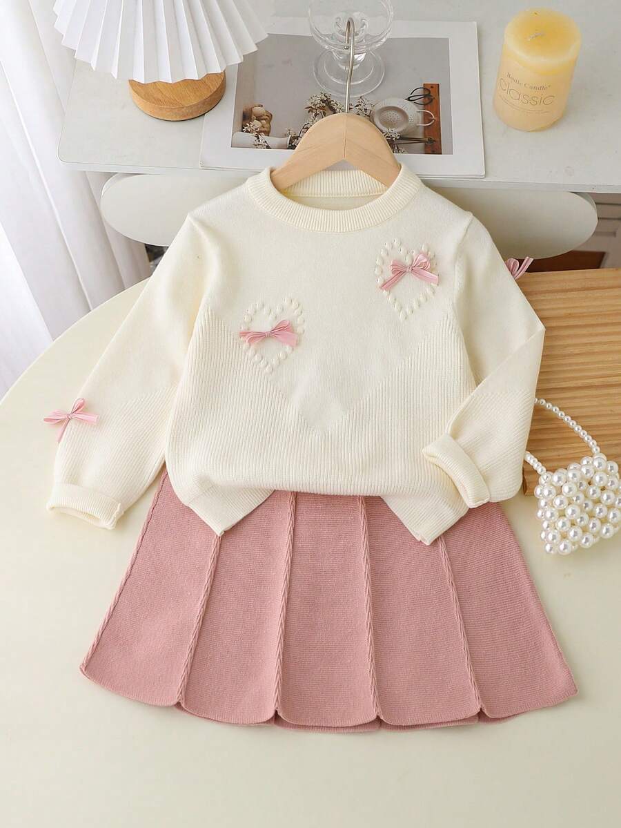 Souflis Souflis 2 pezzi Set di maglione con fiocco e gonna plissettata ...