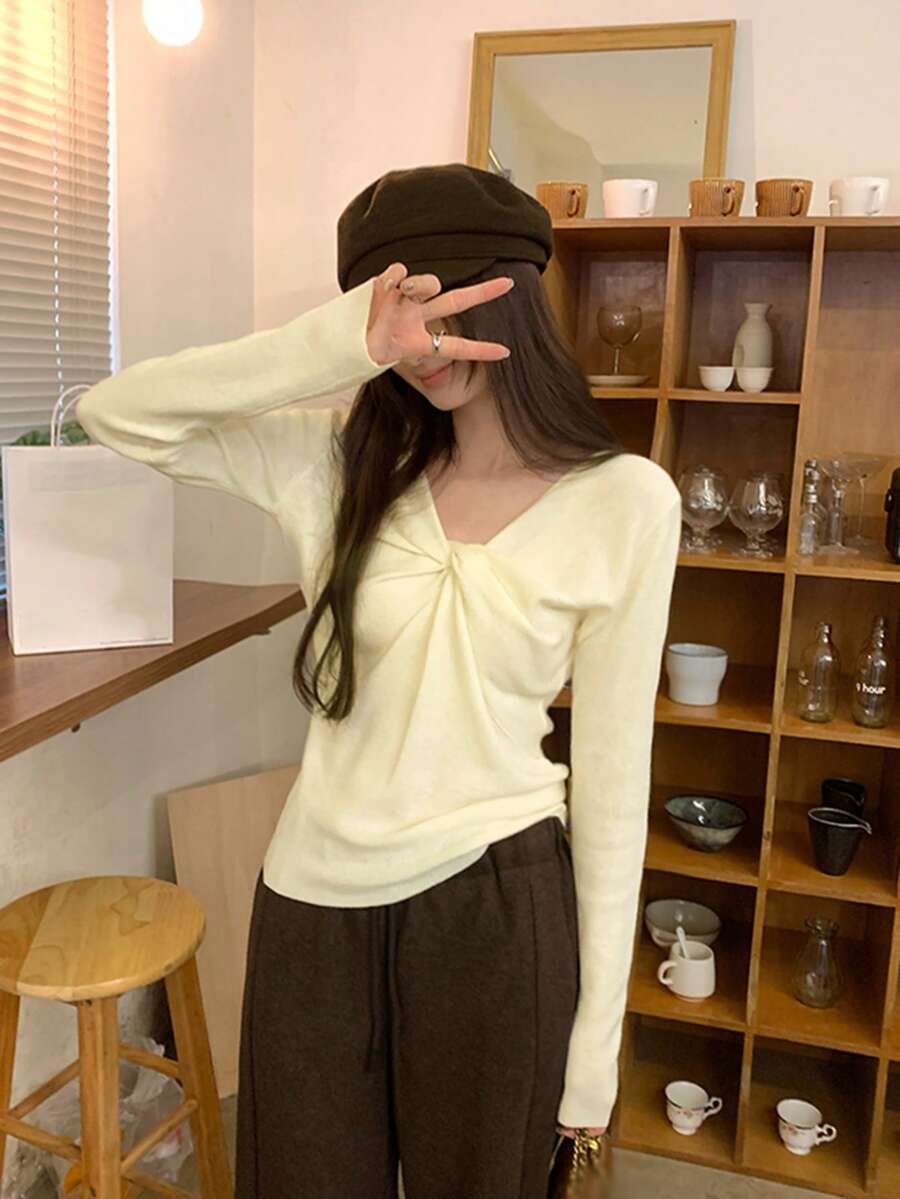 Maglione aderente a maglia con design a torsione, top di alta qualità ...